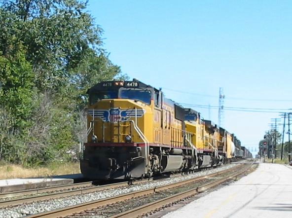 UP 4478 leads an unknown unit and UP 9743 west